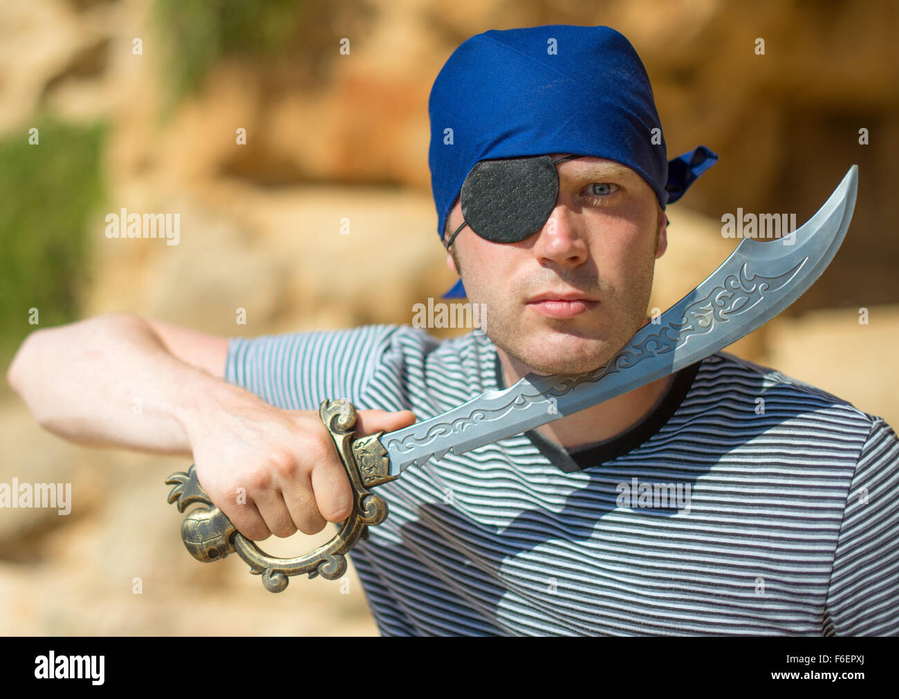 Male pirate with sword. Place for your text Stock Photo - Alamy
