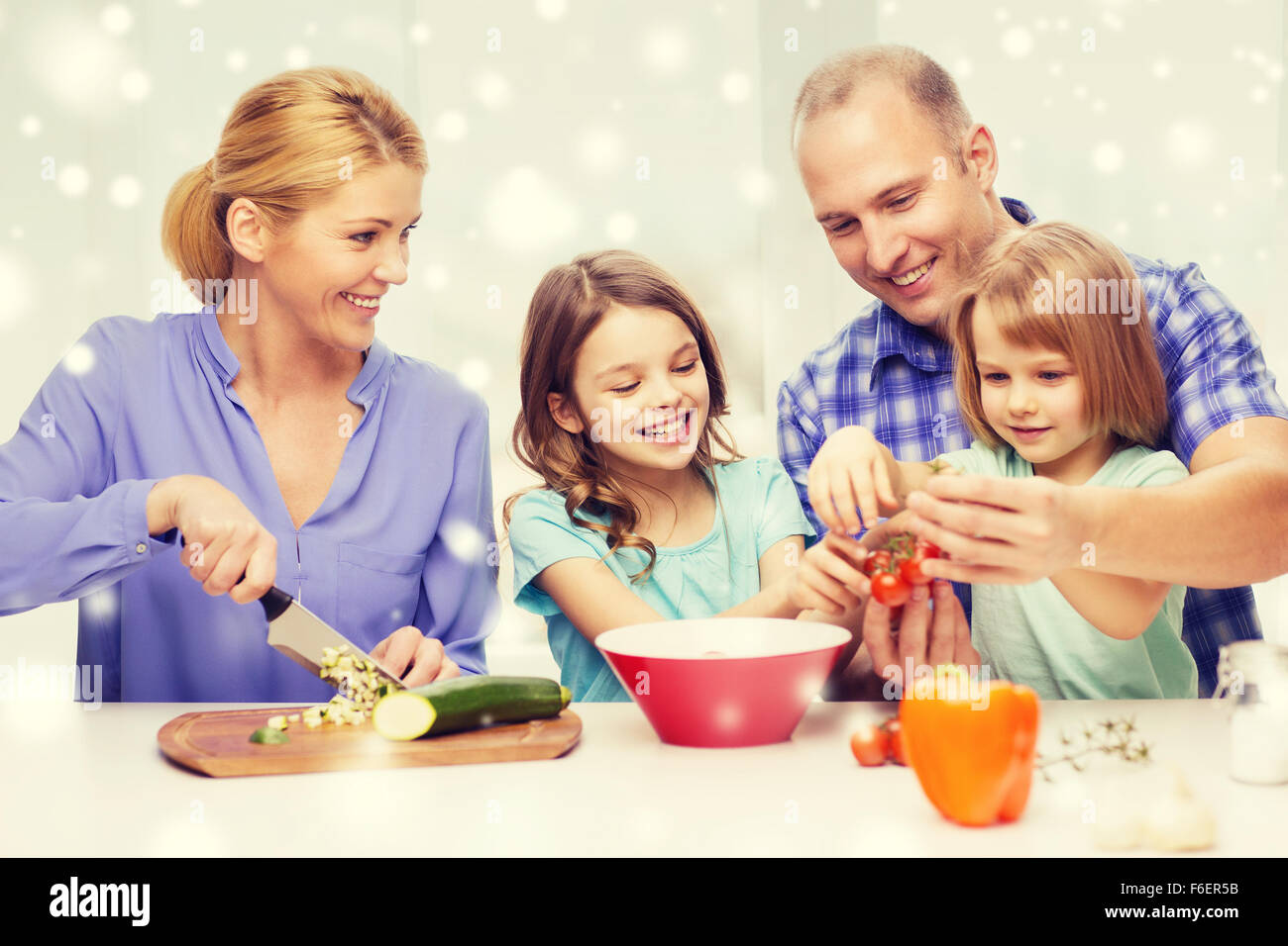 happy family with two kids making dinner at home Stock Photo - Alamy