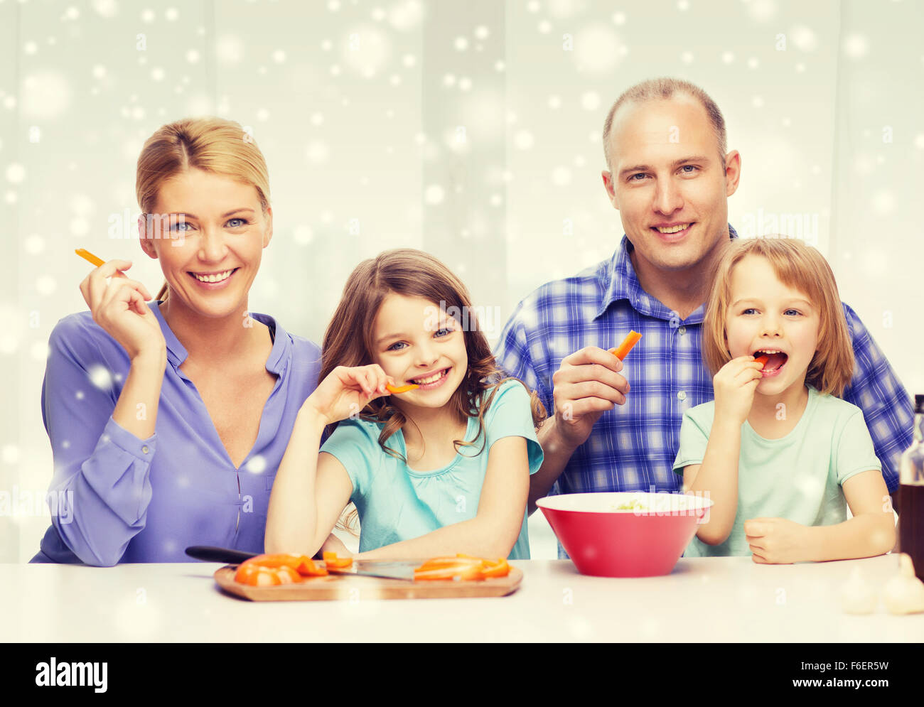 happy family with two kids making dinner at home Stock Photo - Alamy