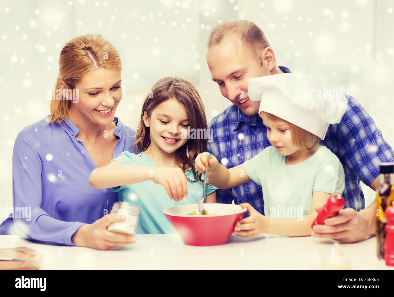happy family with two kids making salad at home Stock Photo - Alamy