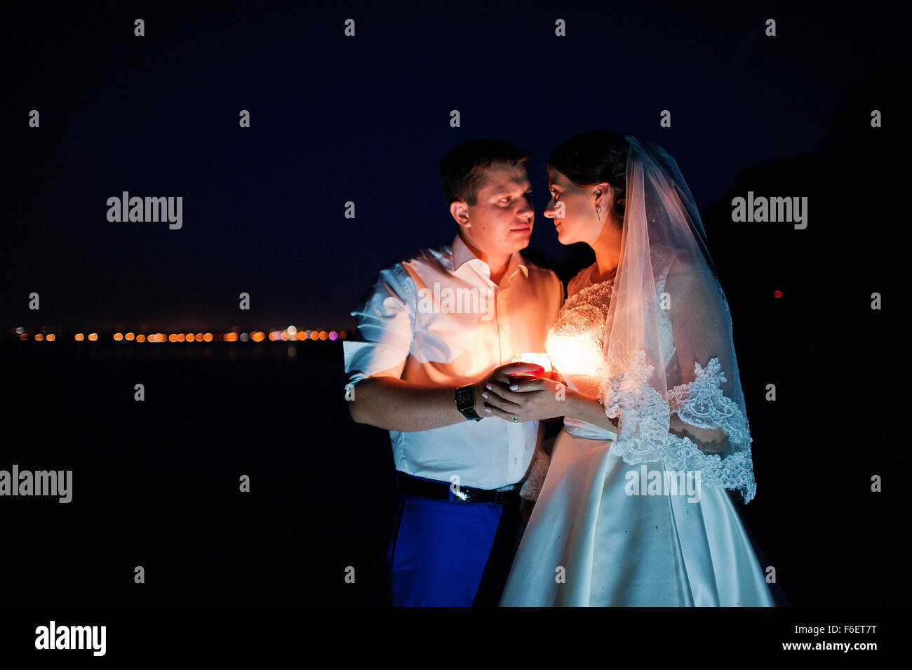 happy marriage at night with candles Stock Photo - Alamy