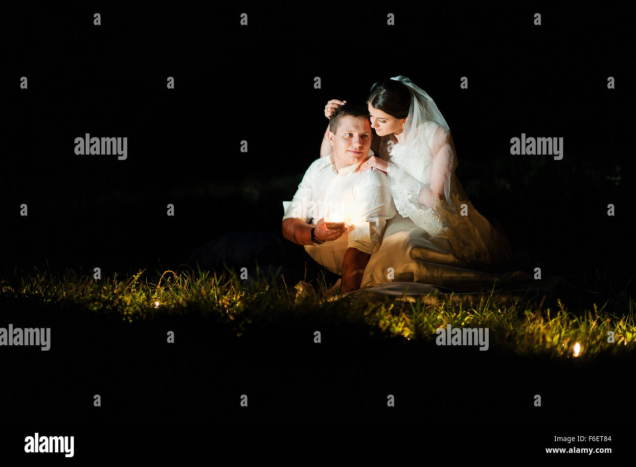 happy marriage at night with candles Stock Photo - Alamy