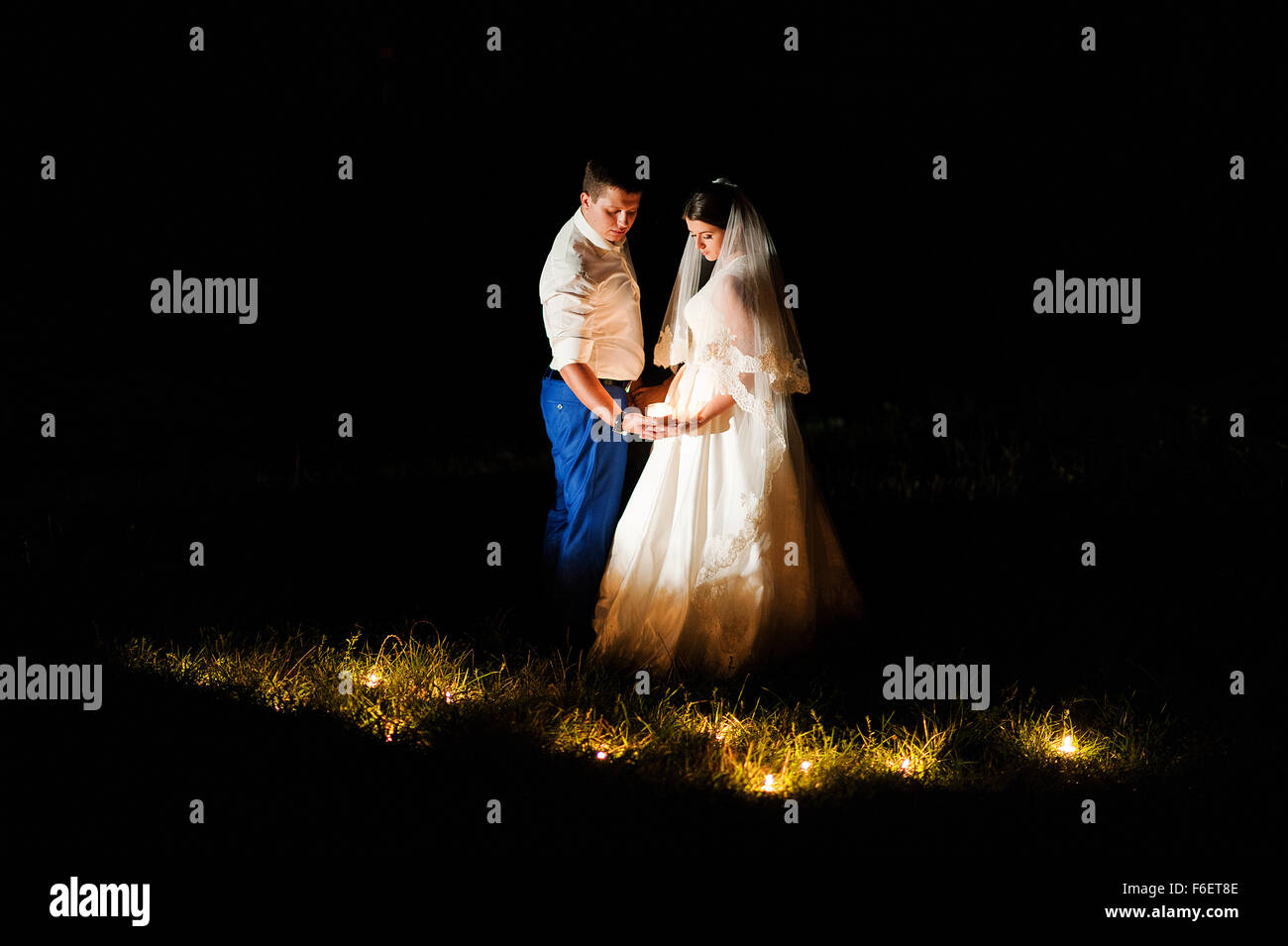 happy marriage at night with candles Stock Photo - Alamy