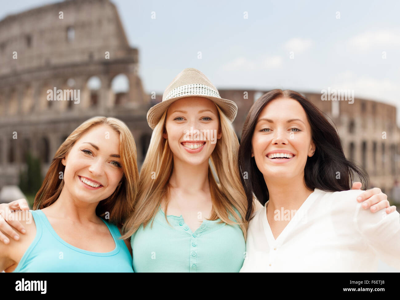 group of happy young women over coliseum Stock Photo - Alamy