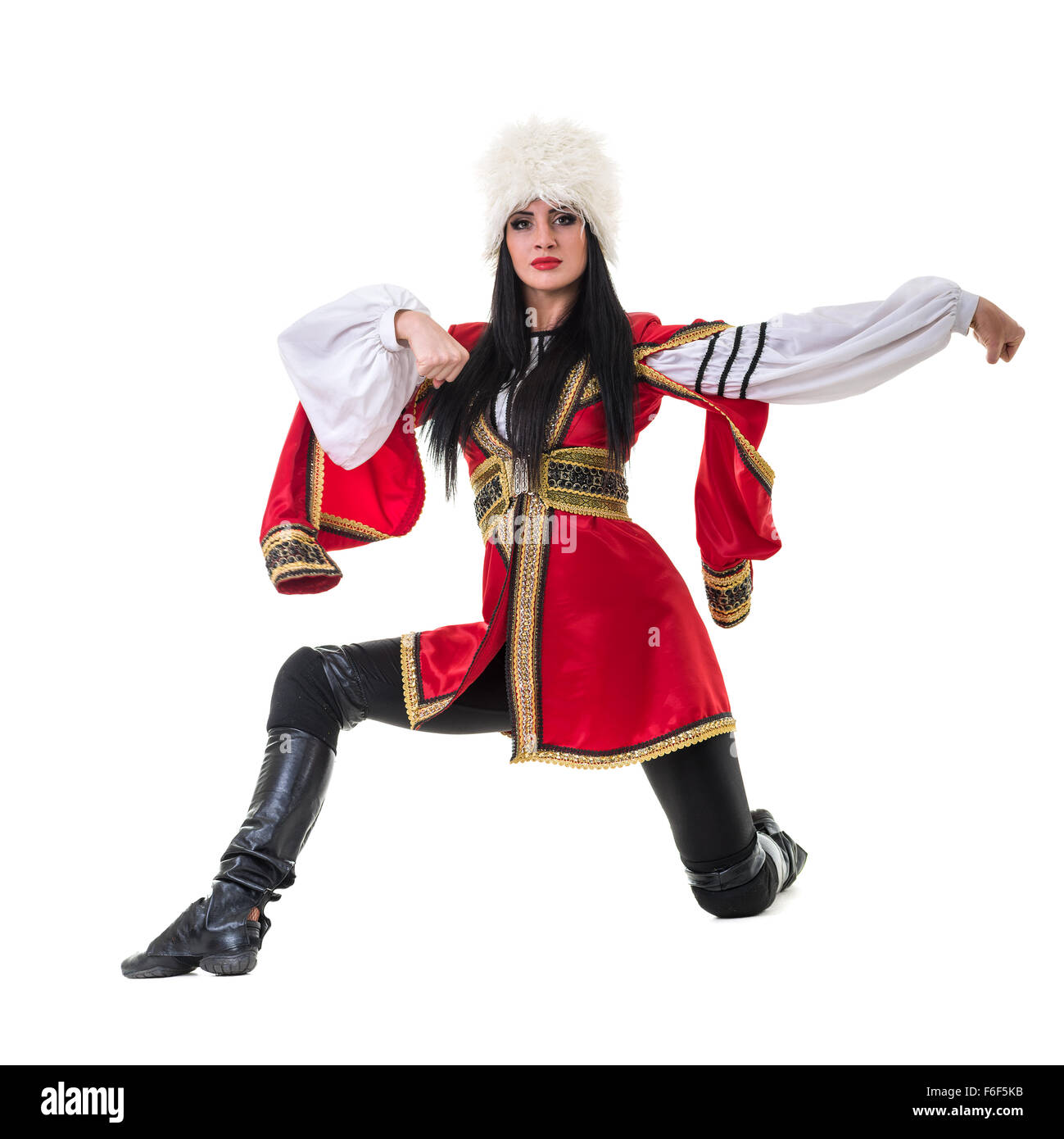 Young woman wearing a folk costumes dancing. Isolated on white in full ...