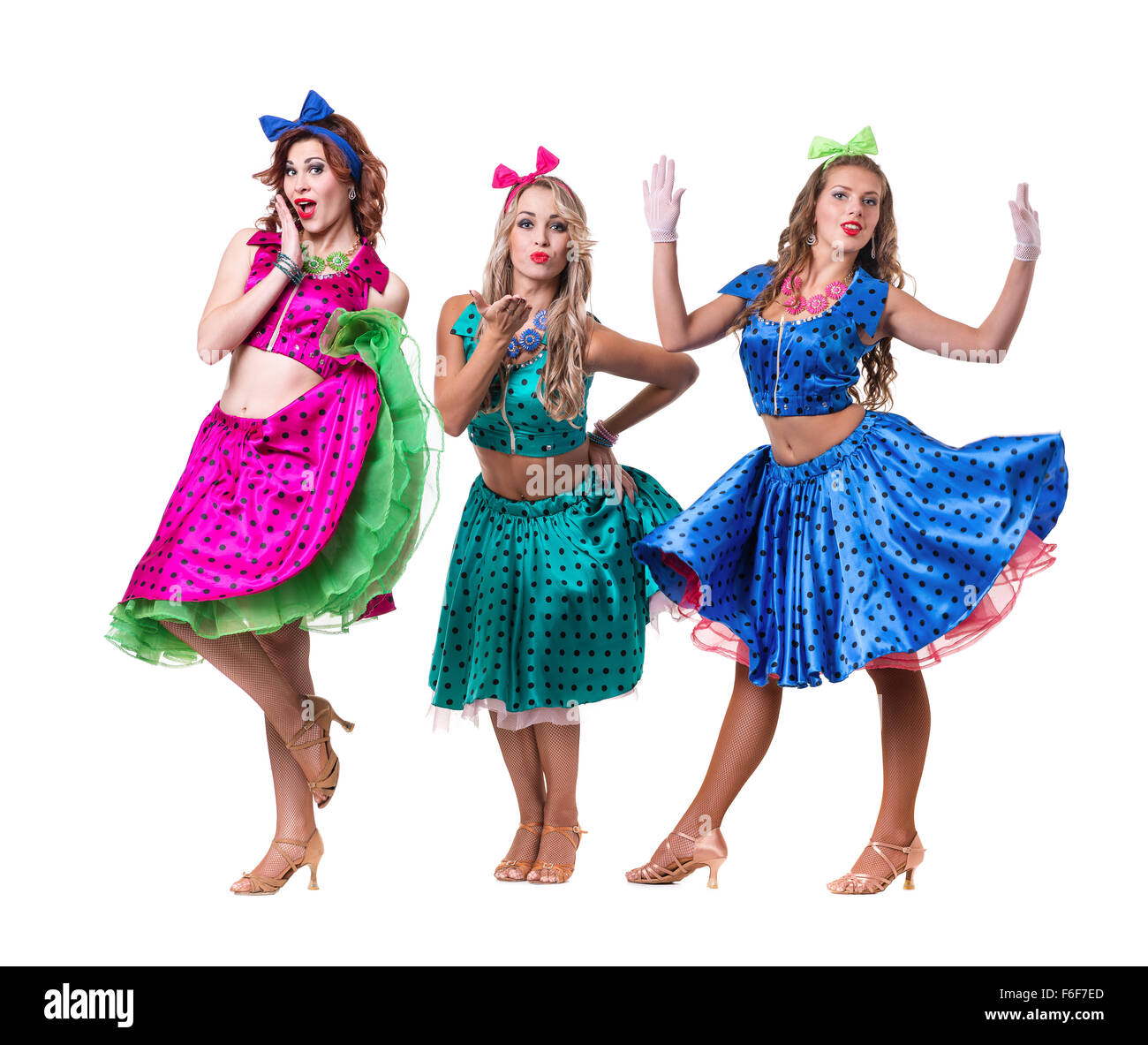 Female disco dancers showing some movements against isolated white ...