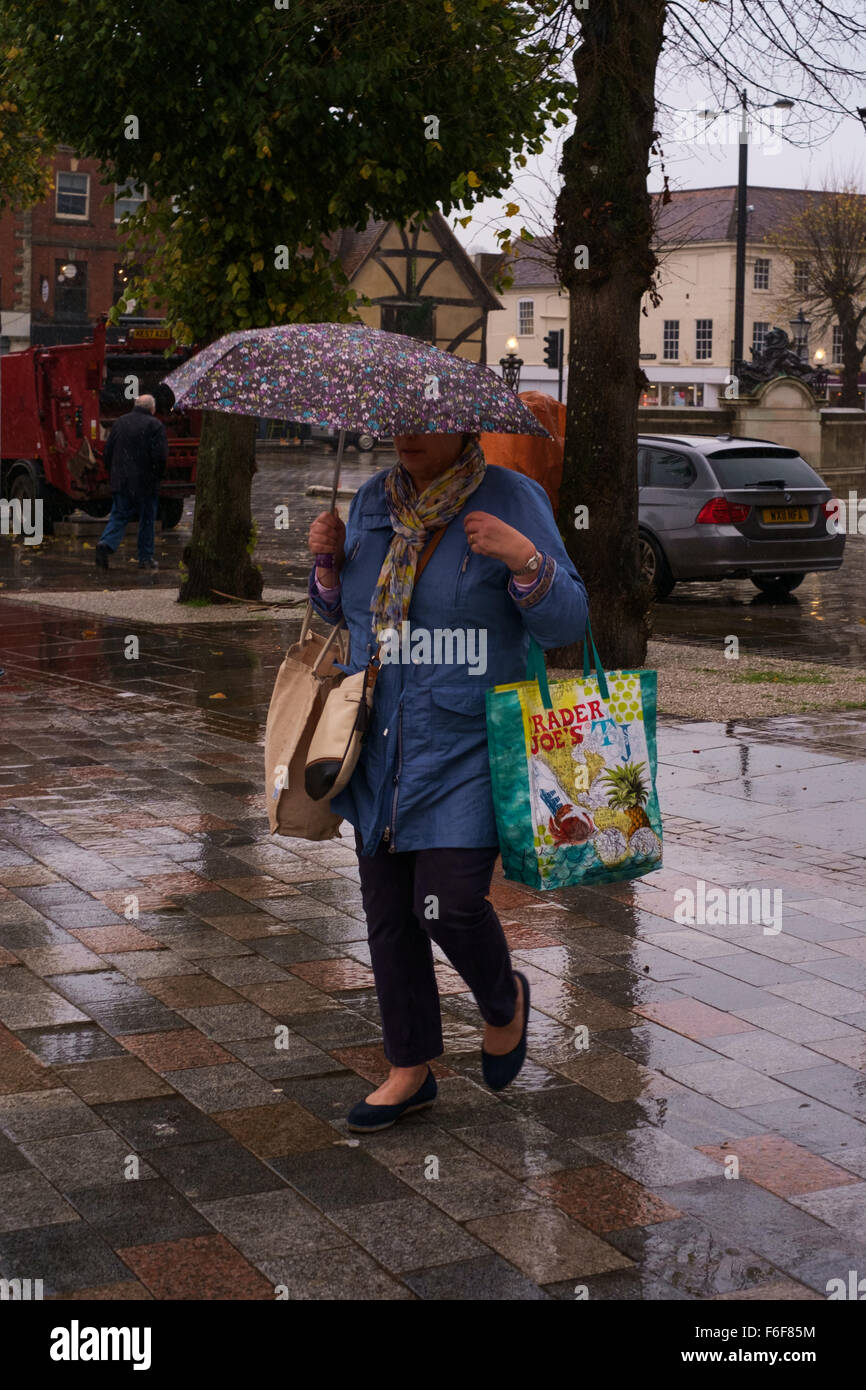 A tourist shopping at the market on a very wet day shopping in ...