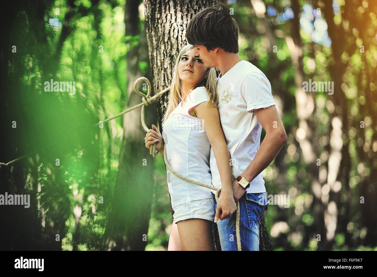 Romantic couple on forest Stock Photo - Alamy