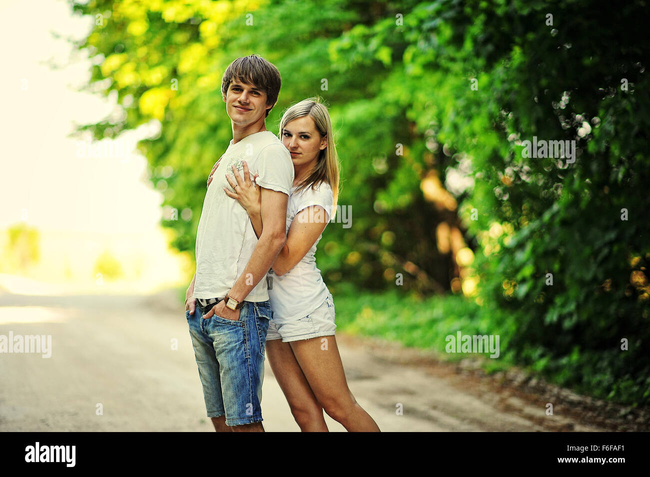 Romantic couple on forest Stock Photo - Alamy