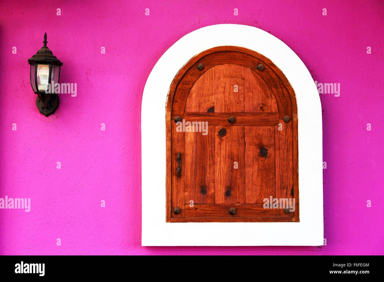 Window and lamp on the outside of a traditional Mexican house, Puerto ...