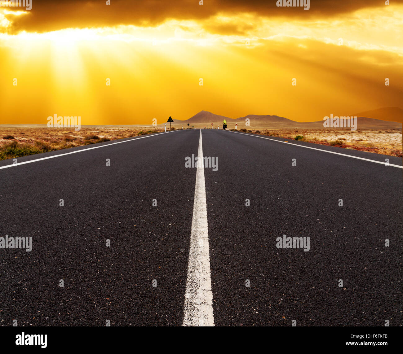 sunset over road Stock Photo - Alamy