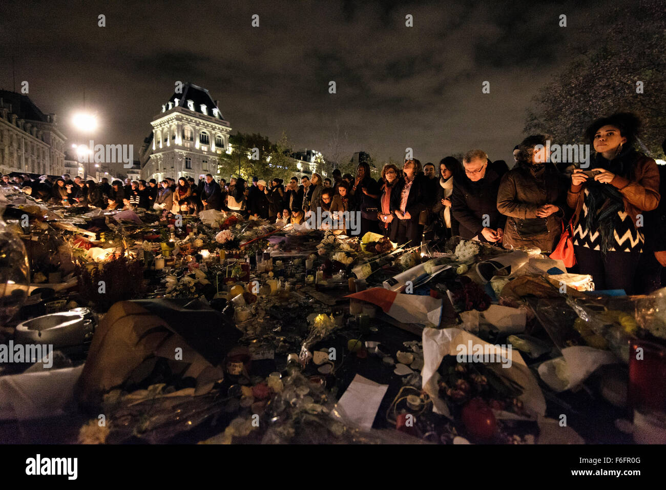 Paris, France. 16th November, 2015. Mourners light candles and lay ...