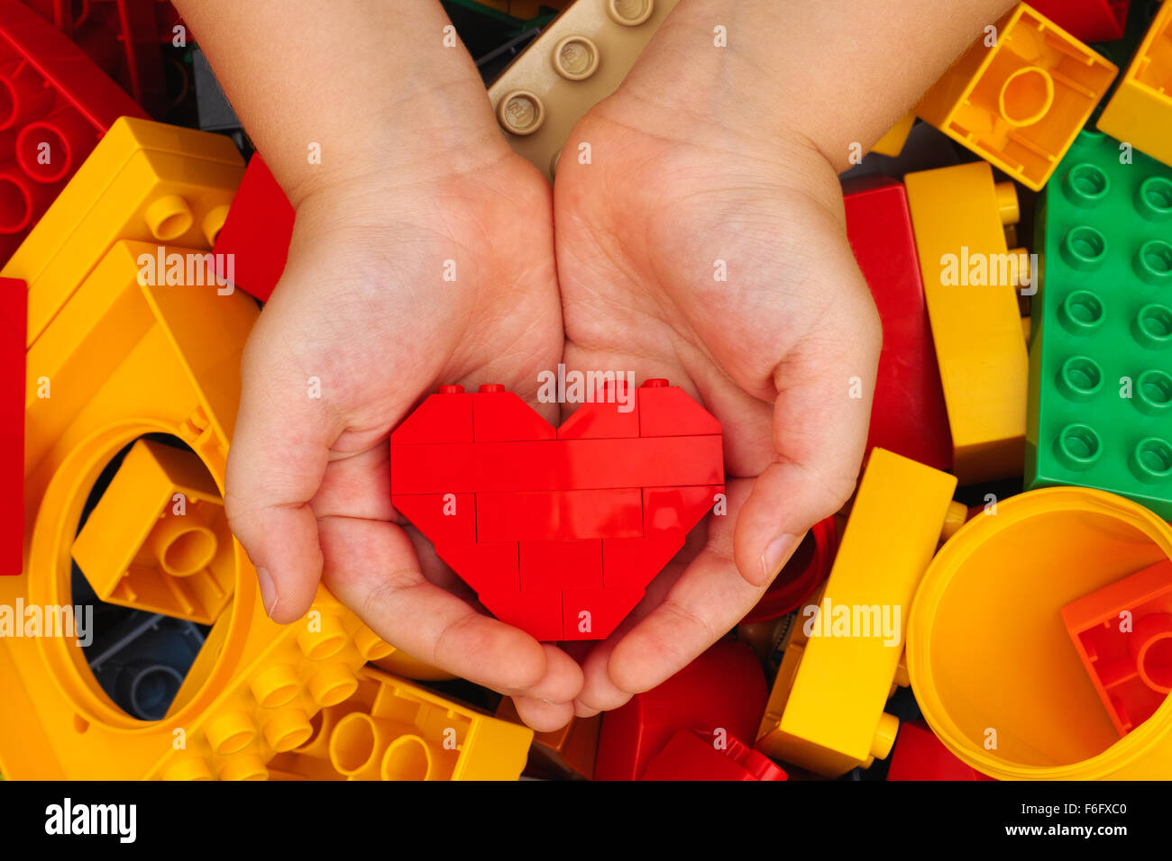 Tambov, Russian Federation - September 07, 2015 Lego red heart in child ...