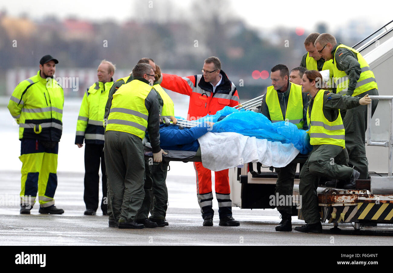 A wounded soldier from eastern Ukraine is met by paramedics after a ...