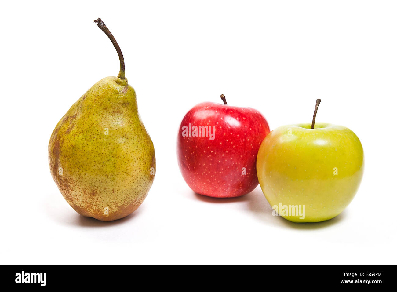 One fresh green pear and two apples in red and green color. Group of ...