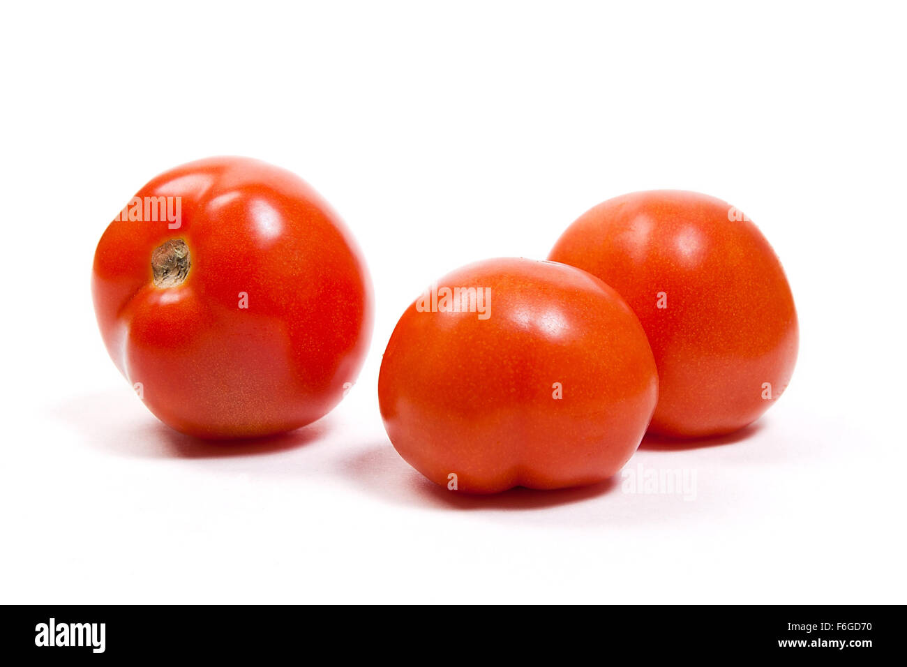Three red ripe tomatoes isolated on white background. Fresh juicy ...