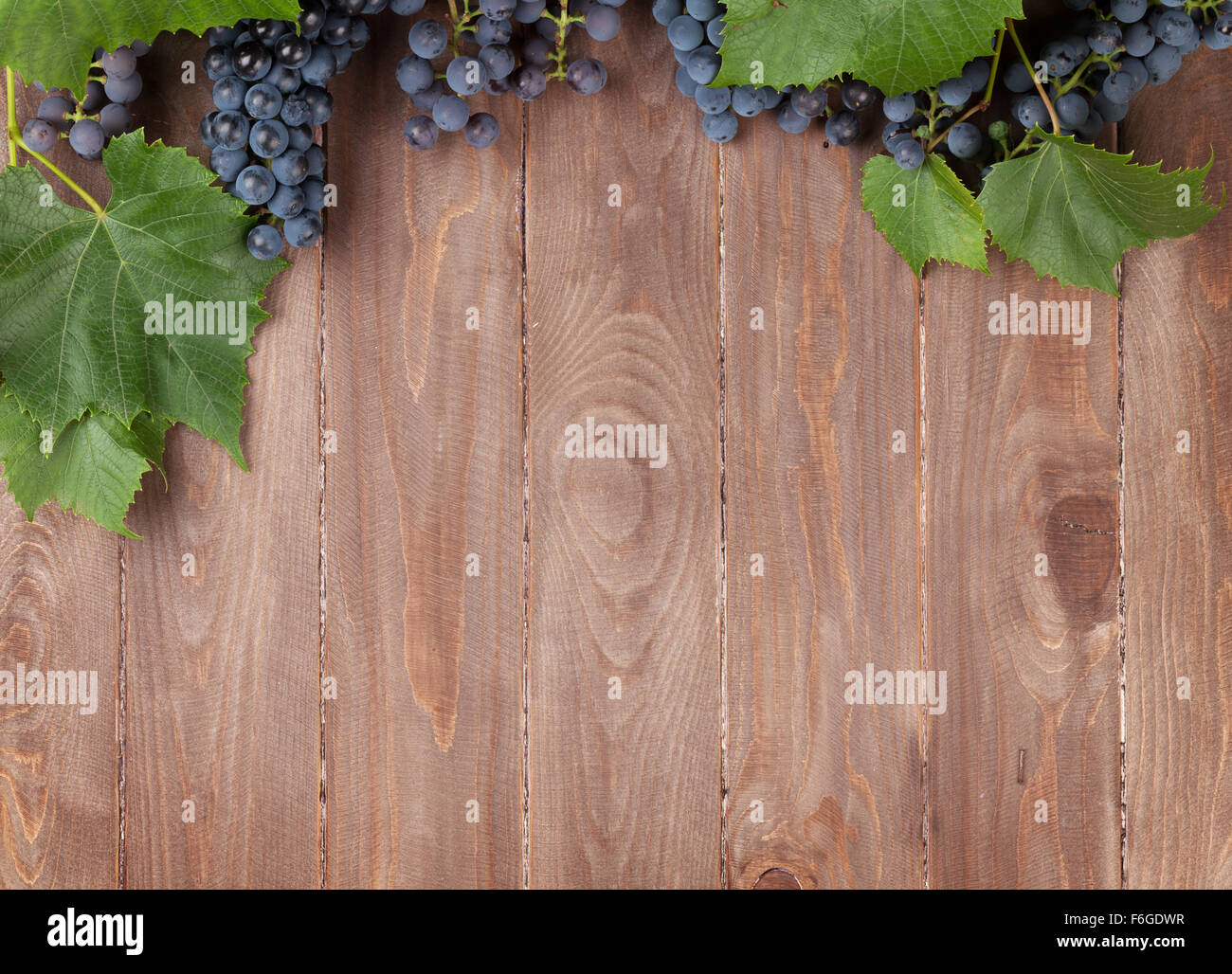 Red grape on wooden table. Top view with copy space Stock Photo - Alamy