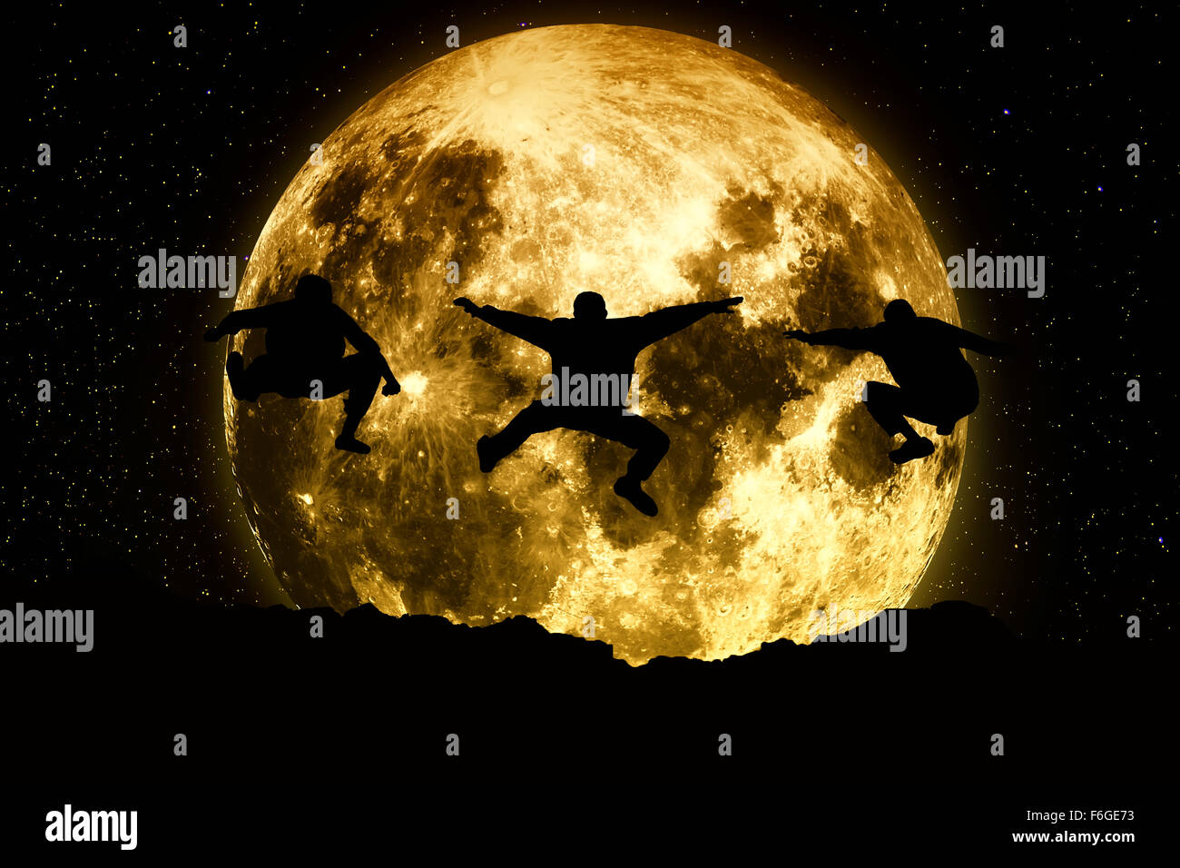 Three friends jumping on a moon background Stock Photo - Alamy