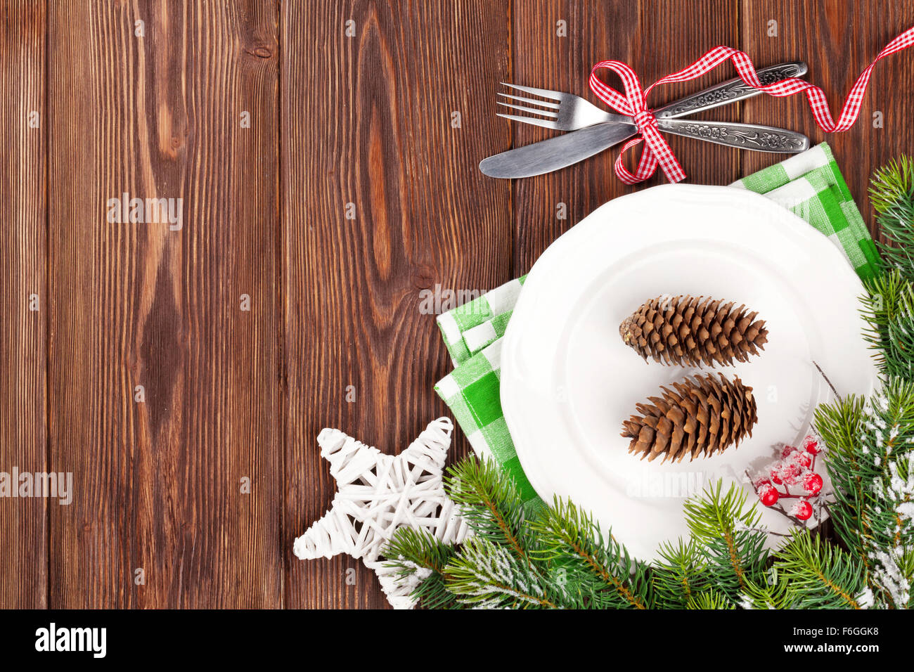 Christmas table setting with fir tree on wooden table. Top view with ...