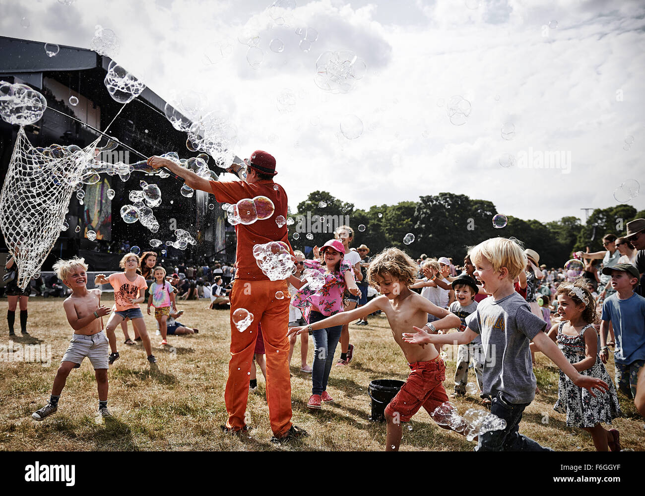 Chasing bubbles at Latitude Festival 18 July 2015 Stock Photo - Alamy