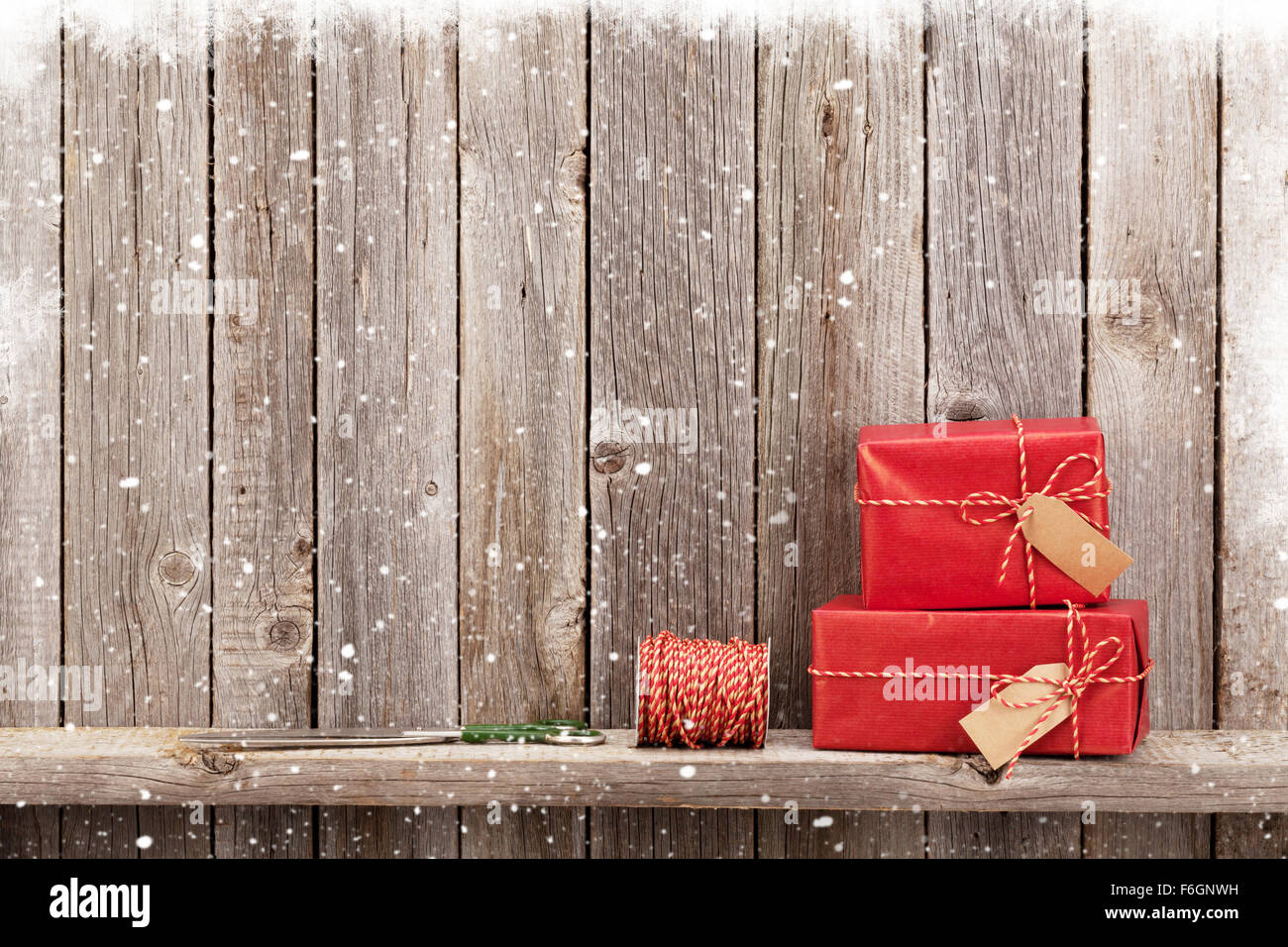 Christmas gift boxes in front of wooden wall with copy space Stock ...