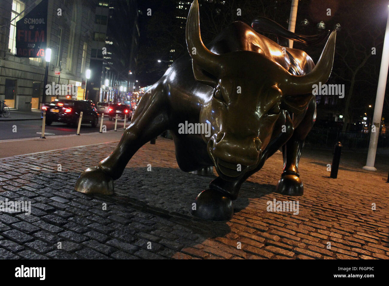 Charging Bull of Wall Street at night Stock Photo - Alamy