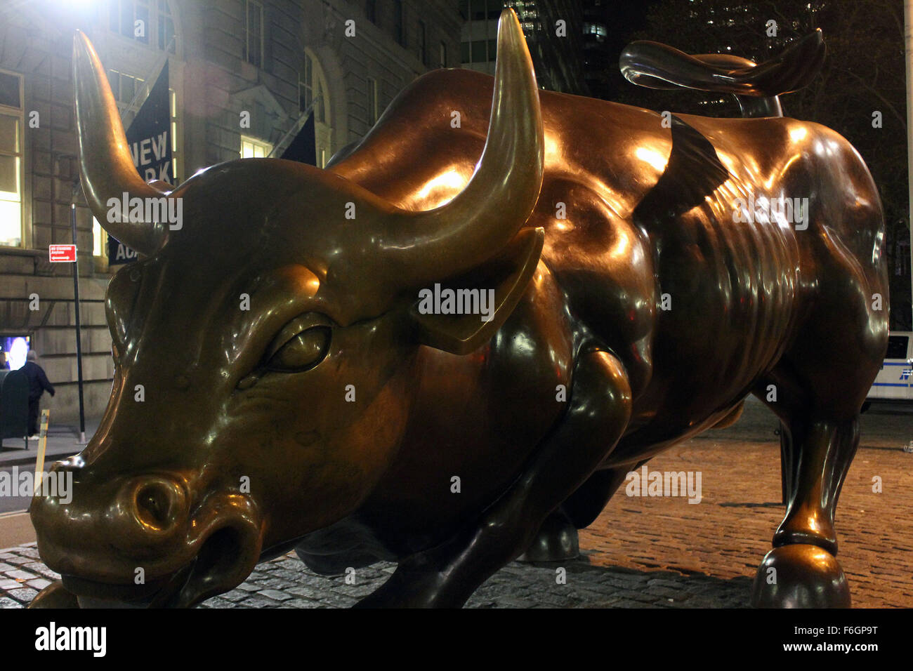 Charging Bull of Wall Street at night Stock Photo - Alamy