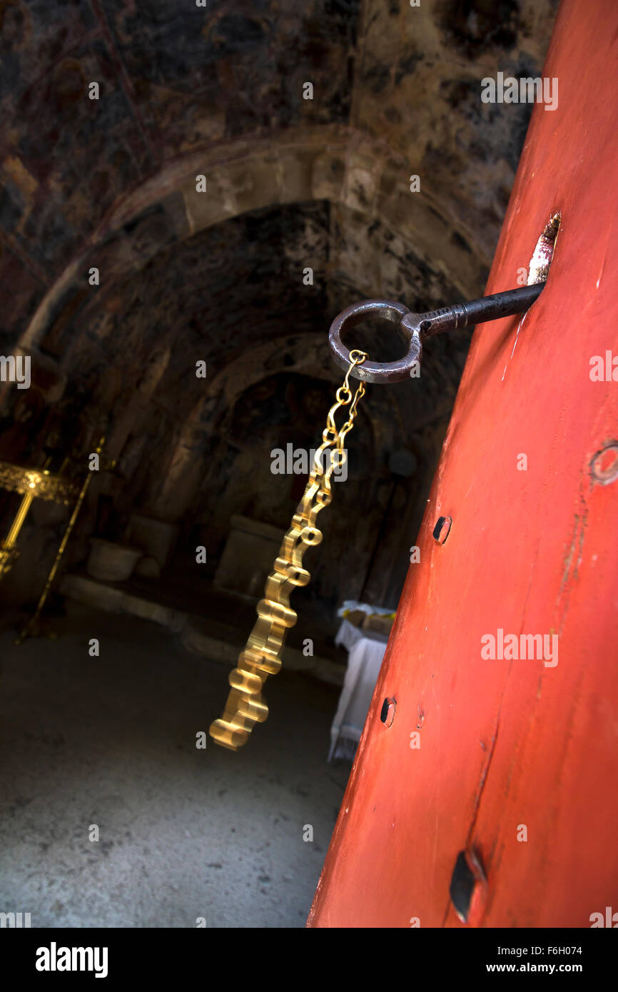 Iron key and gilt hanging chain Stock Photo - Alamy