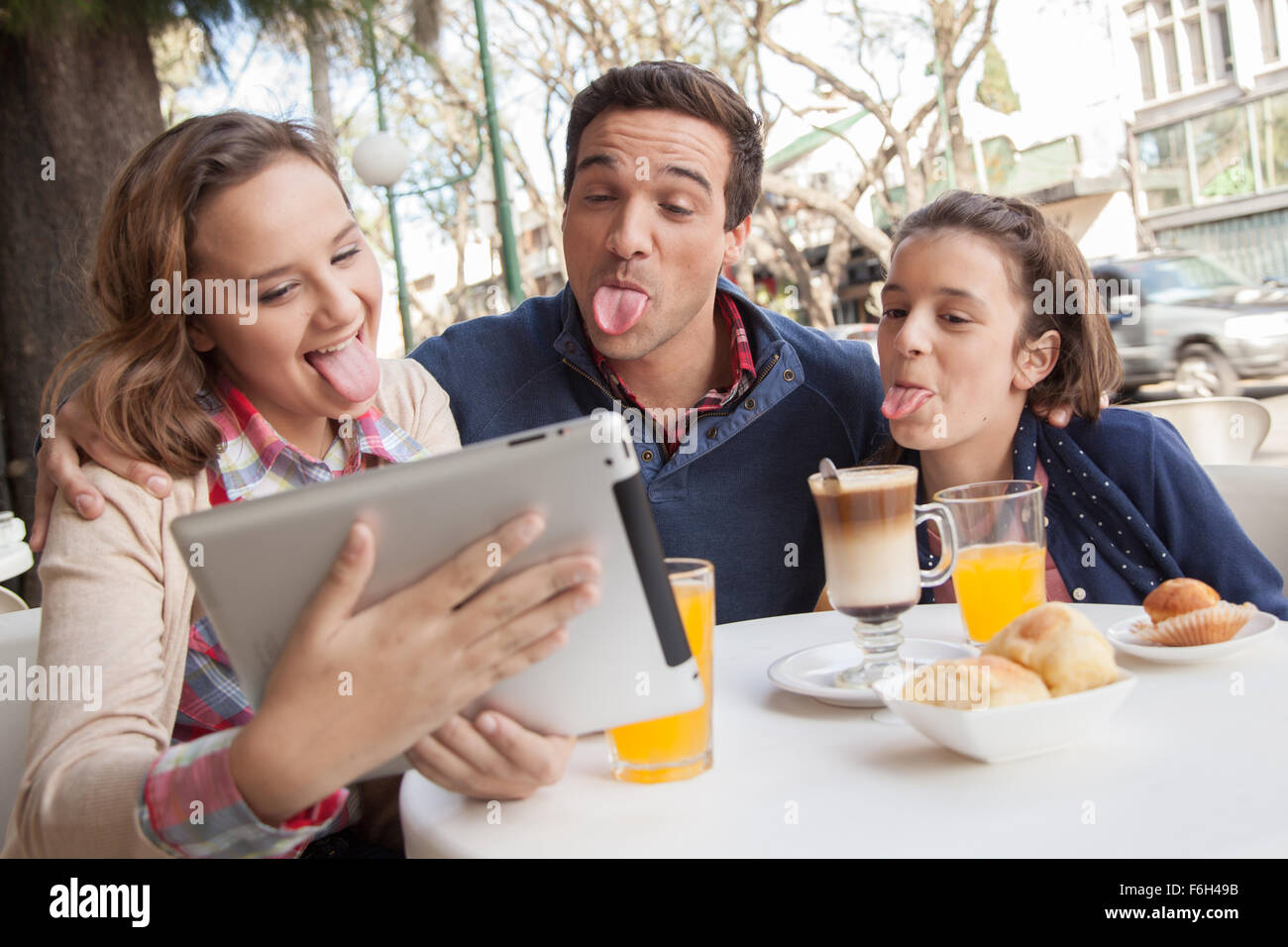 Family in the coffee store Stock Photo - Alamy
