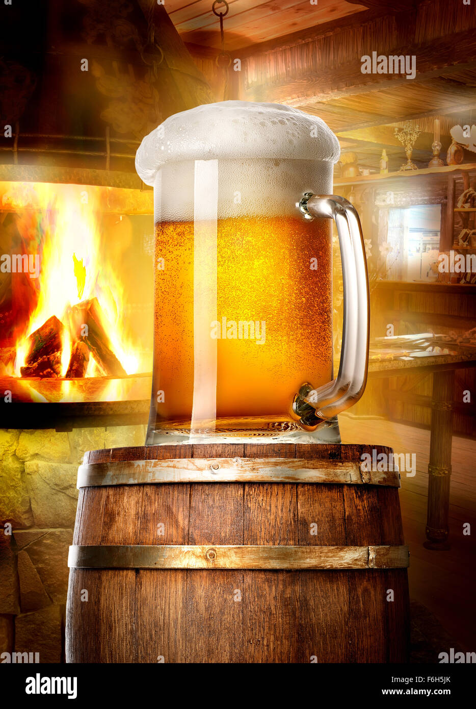 Mug of beer on wooden cask near fireplace in pub Stock Photo - Alamy