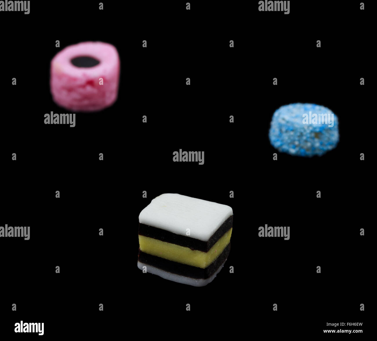 Three liquorice allsorts candy isolated on black background Stock Photo ...