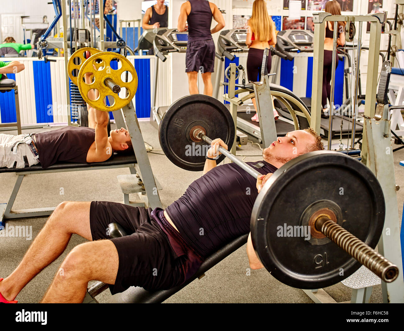 Group of people working with dumbbells at gym Stock Photo - Alamy