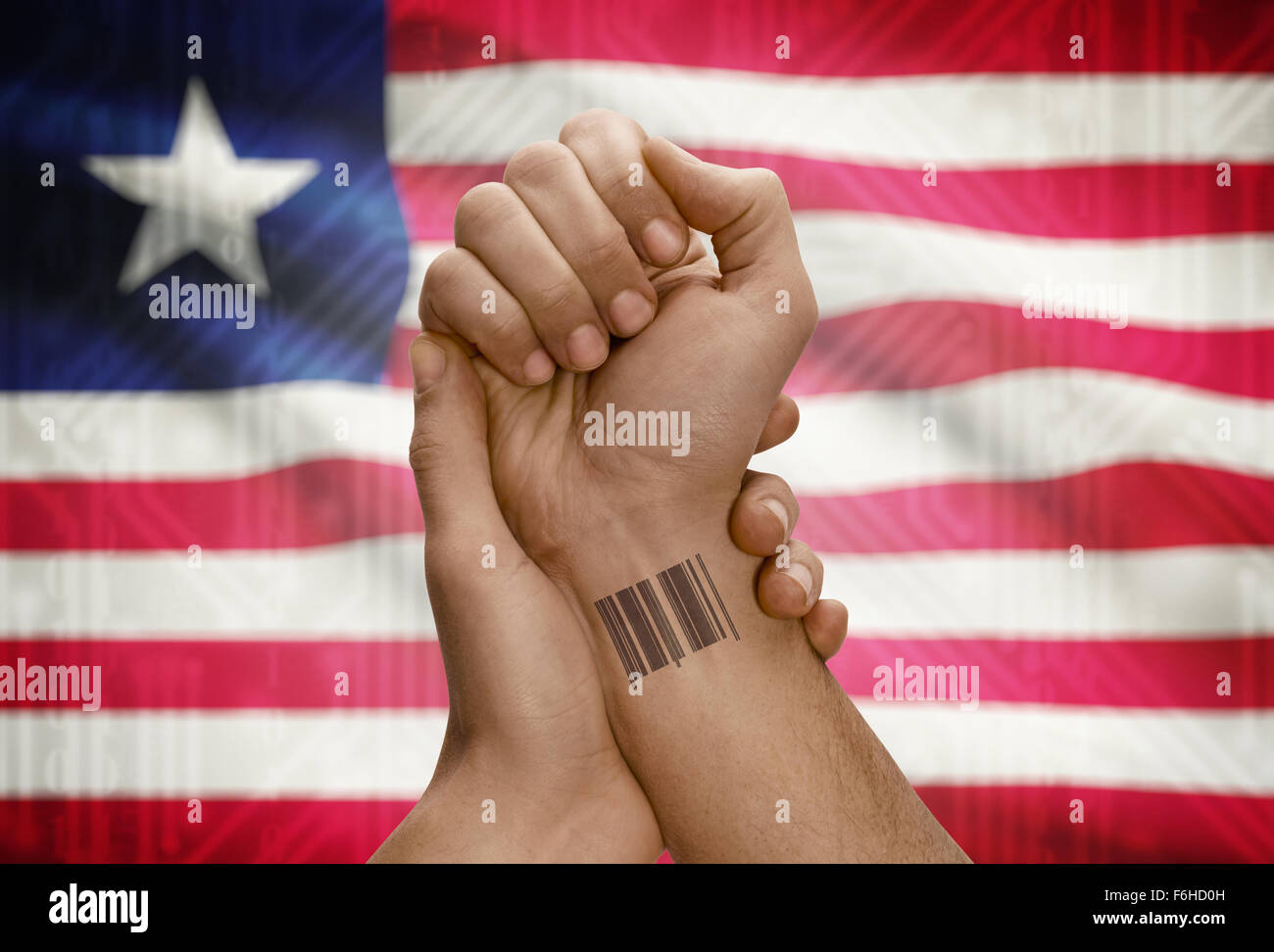 Barcode ID number tattoo on wrist of dark skinned person and national ...
