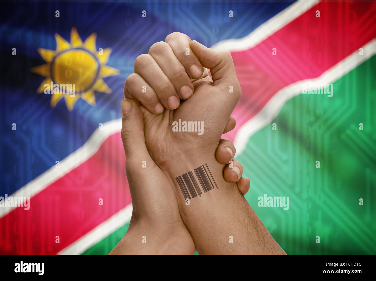 Barcode ID number tattoo on wrist of dark skinned person and national ...