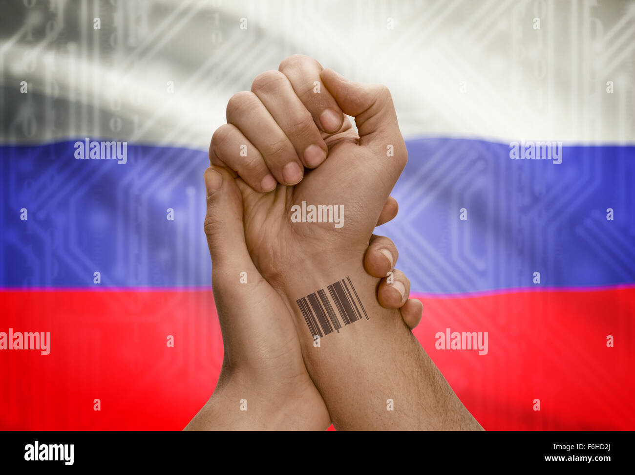 Barcode ID number tattoo on wrist of dark skinned person and national ...