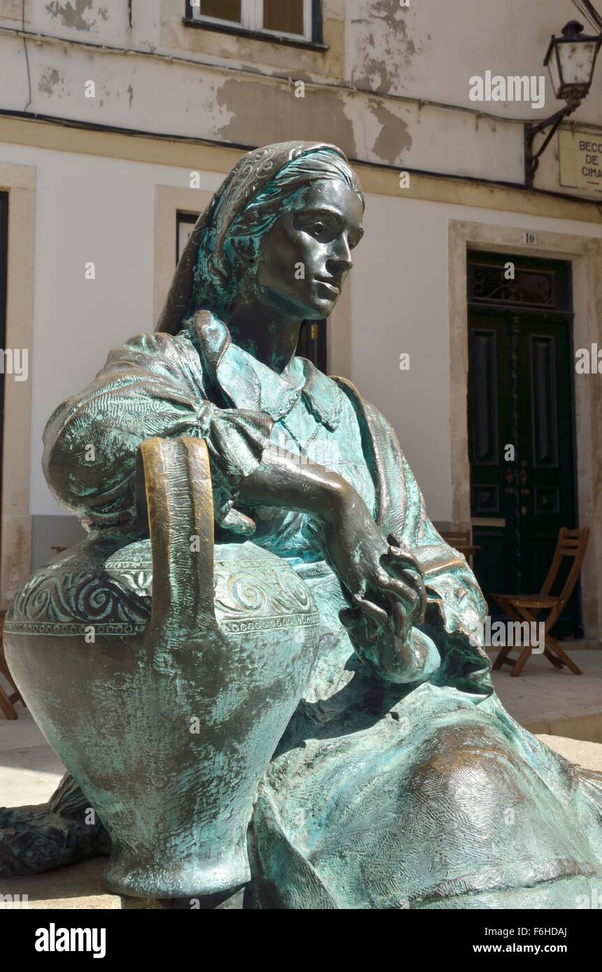 Statue of traditional Portuguese woman in the historical center of ...