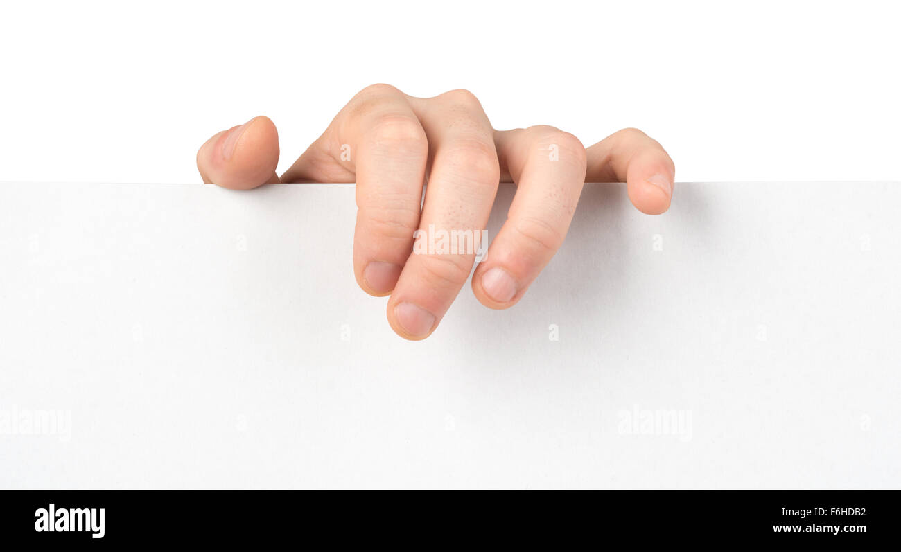 Mans hand holding edge of blank paper Stock Photo - Alamy