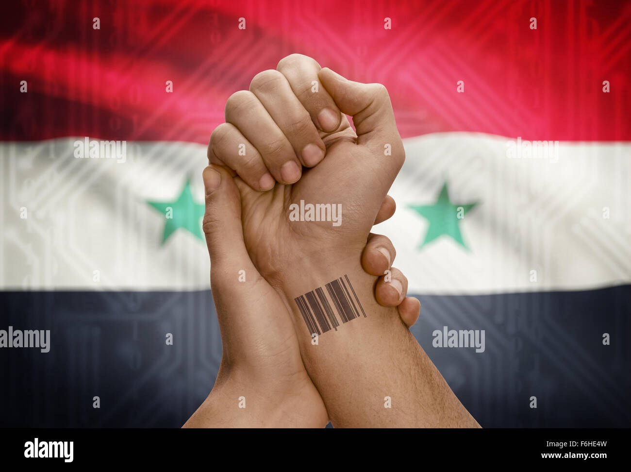 Barcode ID number tattoo on wrist of dark skinned person and national ...