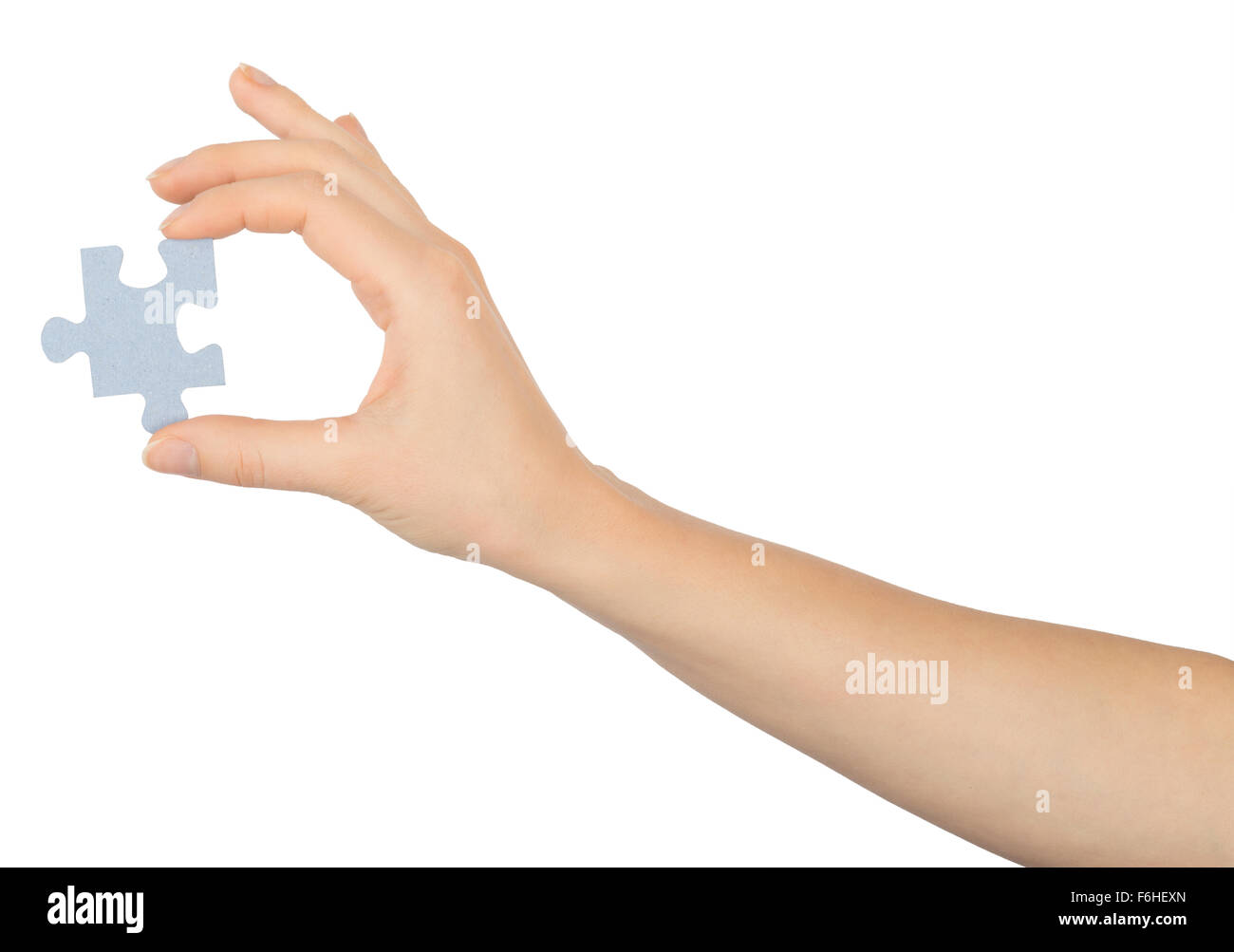 Human hand holding puzzle piece Stock Photo - Alamy
