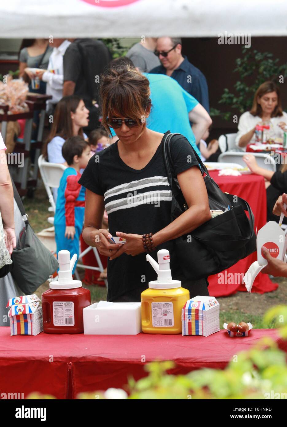 Halle Berry attends a Halloween festival with her husband and son ...