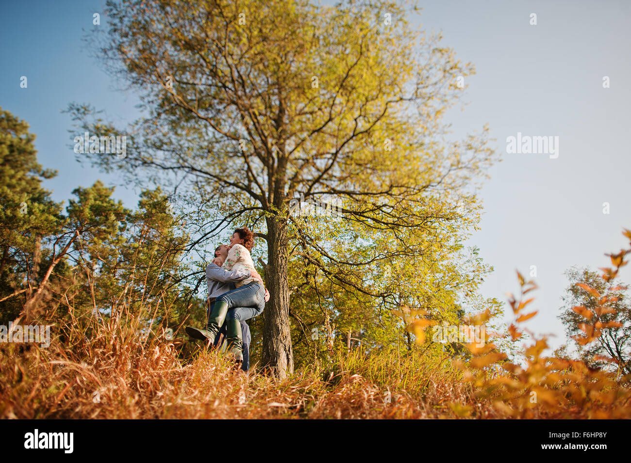 Happy and positive couple in autumn love story Stock Photo - Alamy