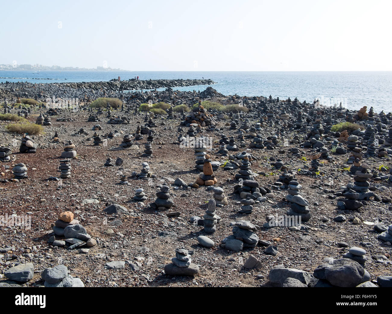 Art of stone balance, piles of stones on the beach. Costa Adeje in ...
