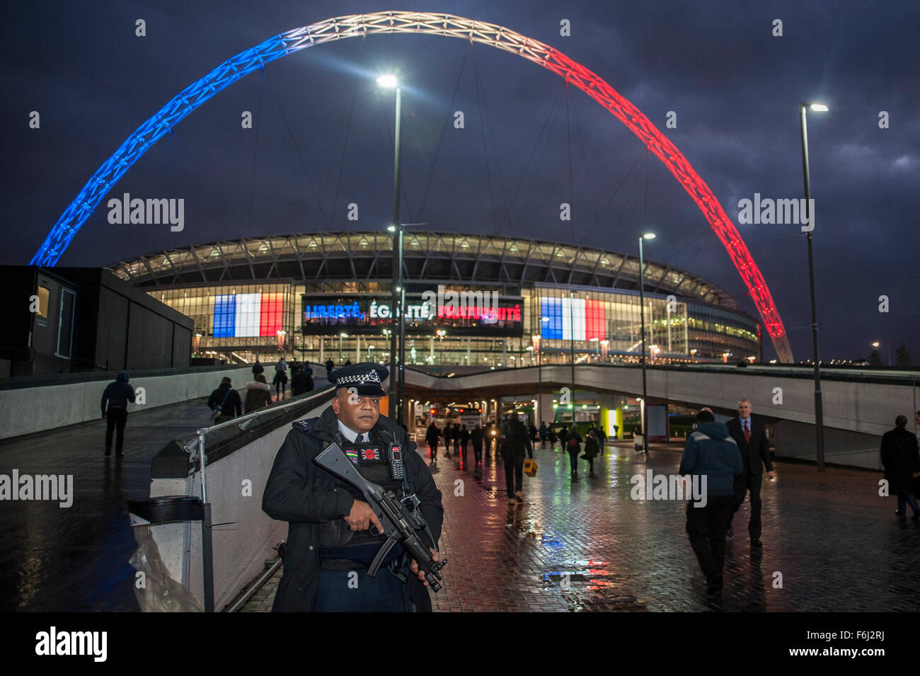 Wembley, UK. 17th Nov, 2015. Armed police monitor crowds arriving at ...