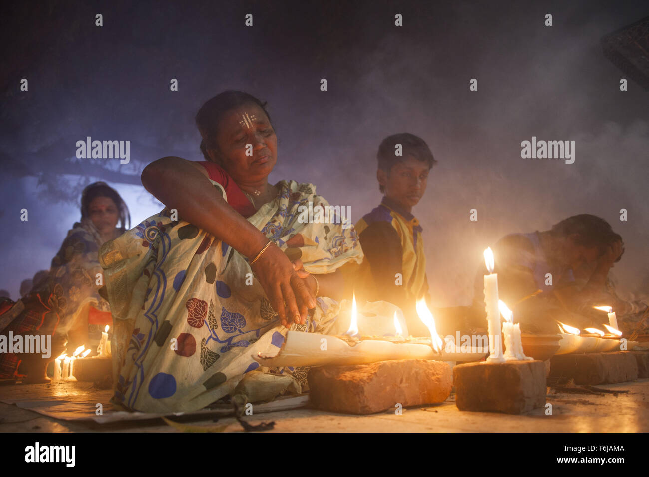 Dhaka, Bangladesh. 17th Nov, 2015. Hindu devotees offer prayer as they ...