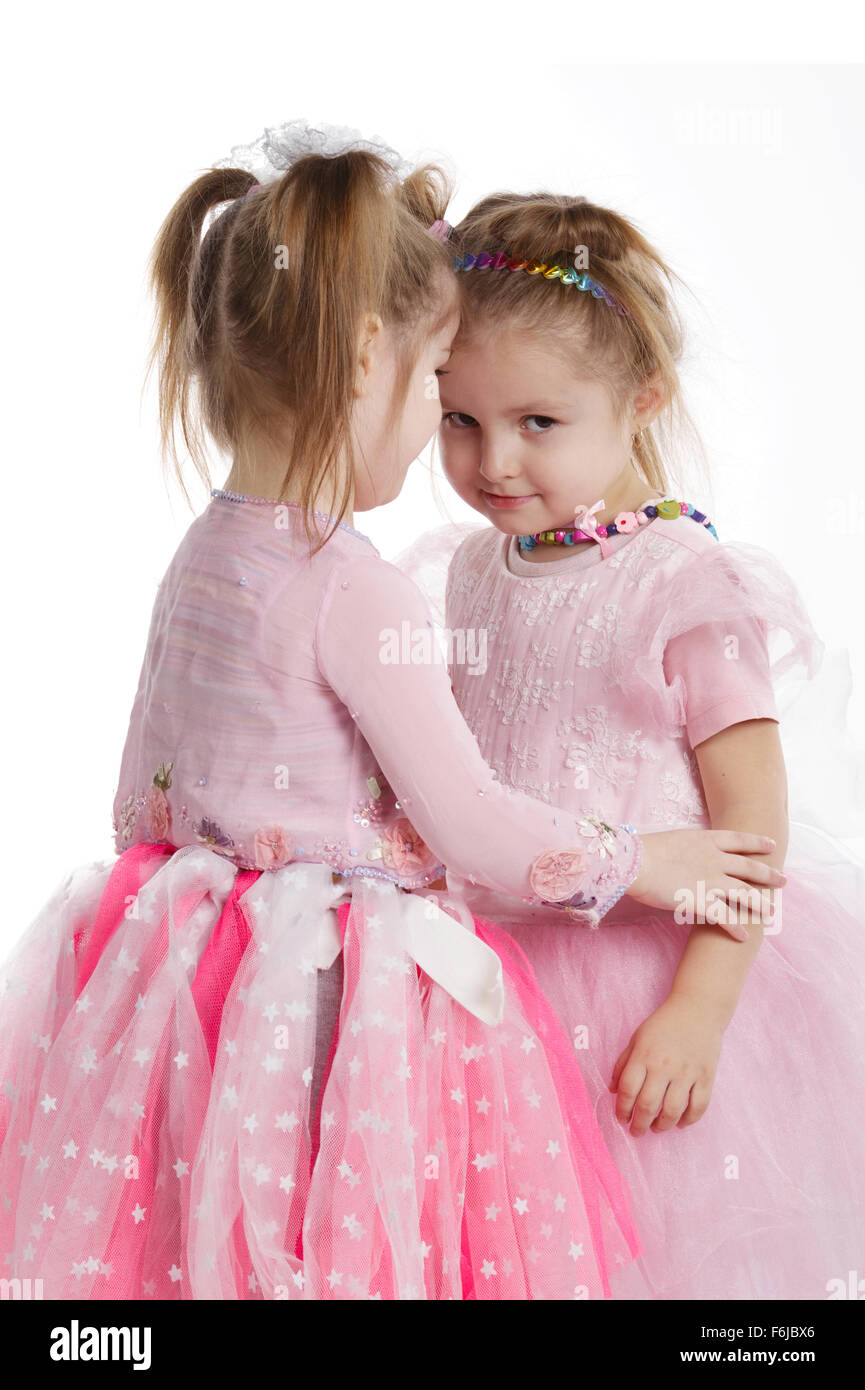 Two little girls - best friends on white Stock Photo - Alamy