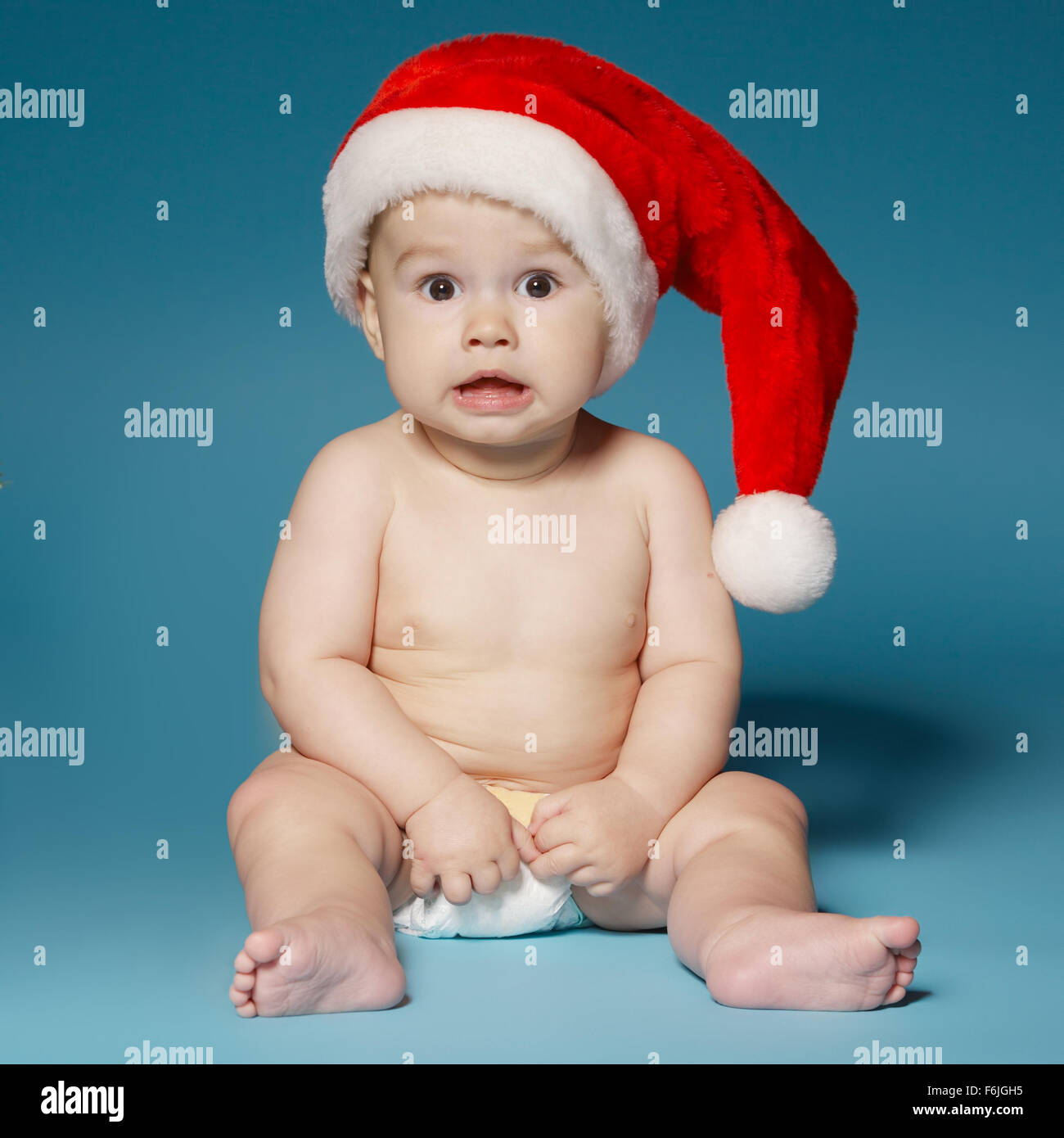 boy in diapers with hat of Santa Claus Stock Photo - Alamy