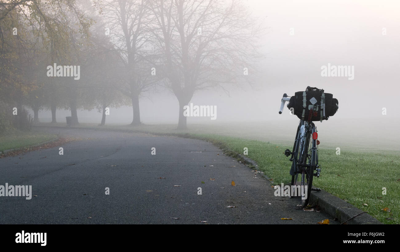 Bicycle in misty autumn landscape Stock Photo - Alamy