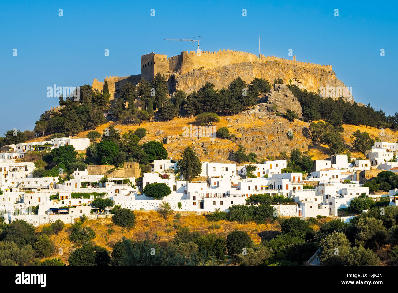Little white houses with the Castle of Lindos above Rhodes Dodecanese ...