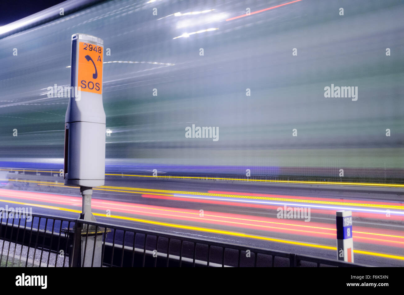 Emergency telephone at night by side of M48 motorway near the Severn ...