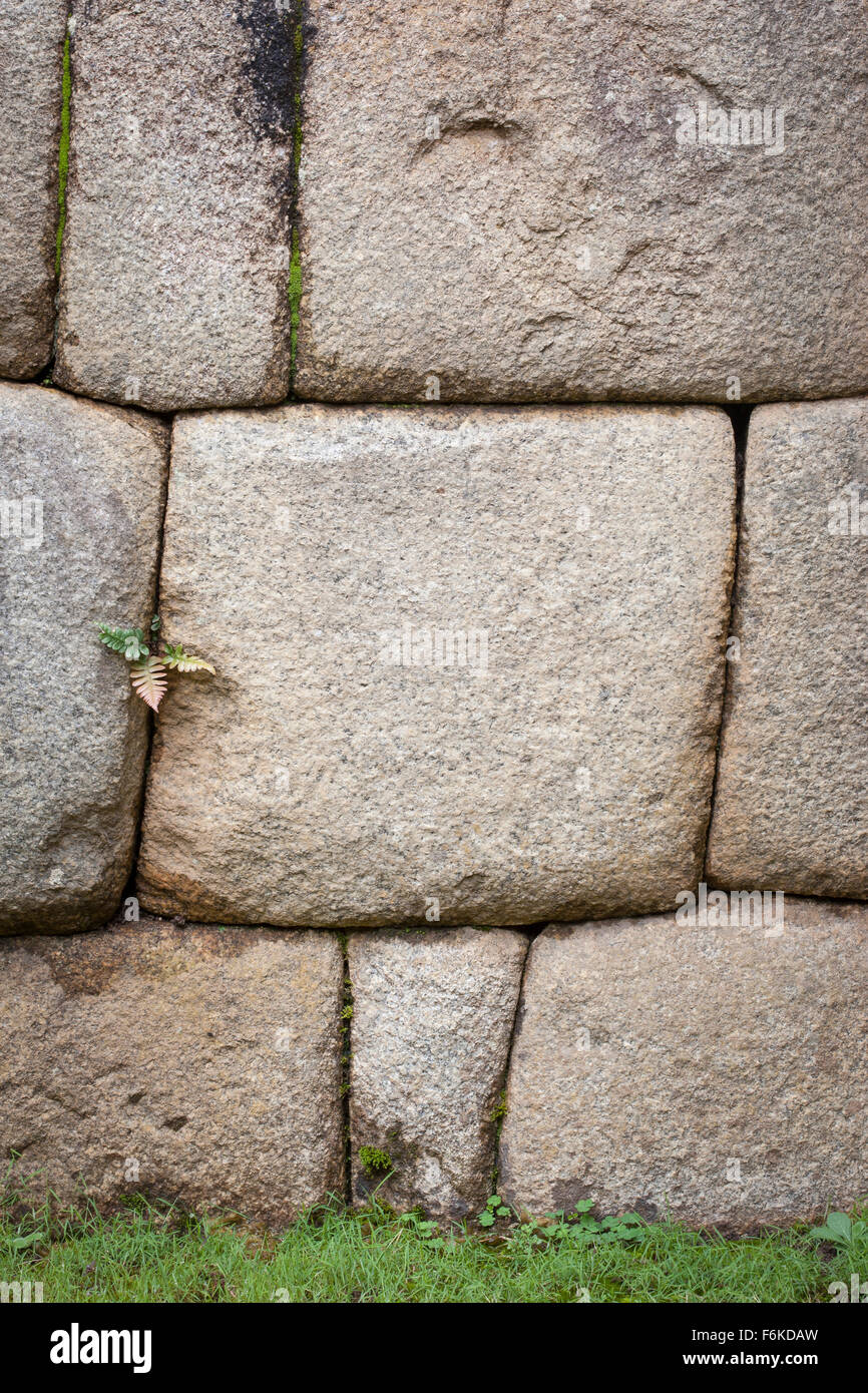 Wall made of stone blocks demonstrates ancient Incan precision building ...